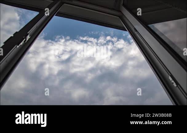 Amazing time lapse: view through window on fluffy clouds floating by ...