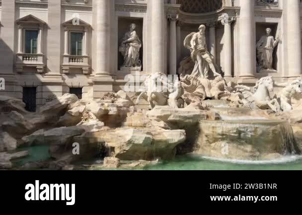 Panoramic movement to the right of the camera frames the Trevi Fountain ...