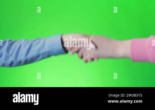 Friends shaking hands. Handshake wiht two hands, keyed green screen ...