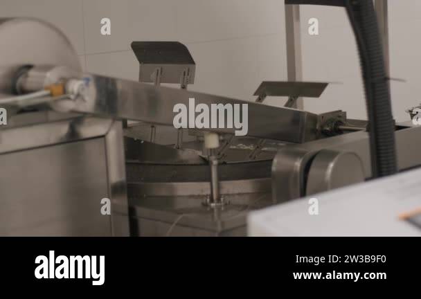 Production of potato chips and snacks. Industrial deep frying machine ...