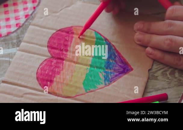 Pride day 2020. Female drawing rainbow flag on carton. Preparation ...