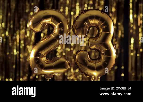 Golden number 23 twenty three made from an inflatable balloon, on a ...