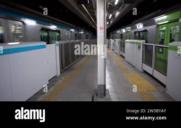 4K, Two trains passing in the same time from a railway station at night ...