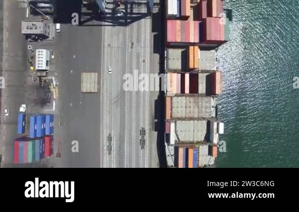 Straight Down Angle Flight Over Cargo Ship with White Heavy Cranes and ...