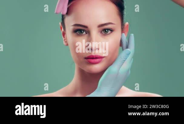 Slow motion clip - Doctor checks a skin before plastic surgery. Face ...