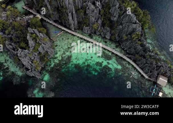 Aerial view of turquoise tropical lagoon with Karst limestone cliffs in ...