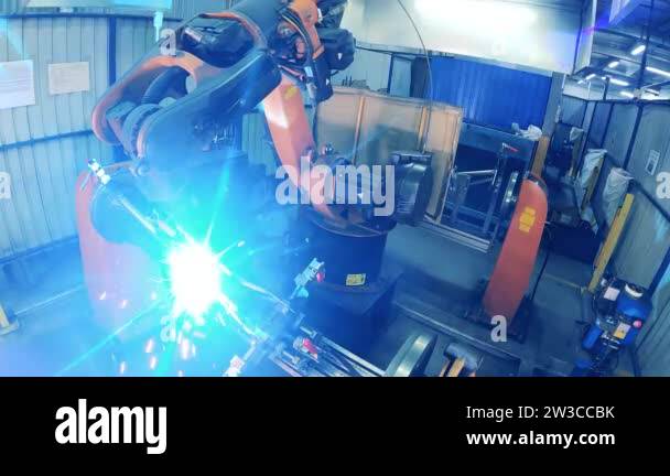 Automated robotic arm welding a rear part of a bike frame Stock Video ...