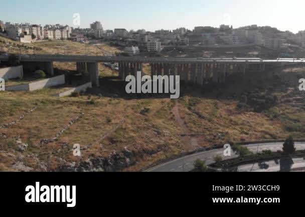 Traffic and bridge in Jerusalem aerialFlying over traffic and bridge in ...