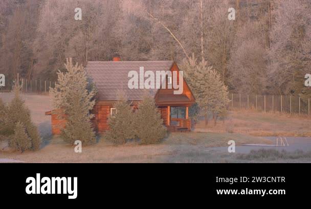 A house on the edge of the forest next to the freeze pond. Surrounded ...