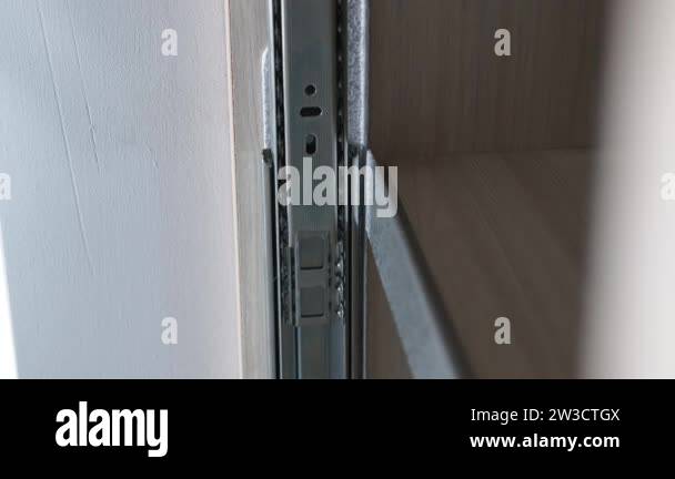 The mechanism of opening of furniture accessories on bearings close up ...