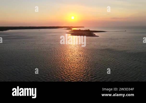 Summer Sunset over sea, ocean, romantic island. Sun with Clouds sunrise. Hot Sun. Red sunsets ...