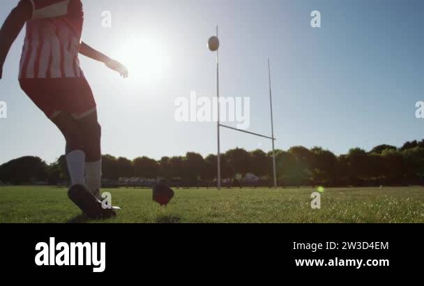 Rear view low section of a teenage mixed-race male rugby player wearing ...