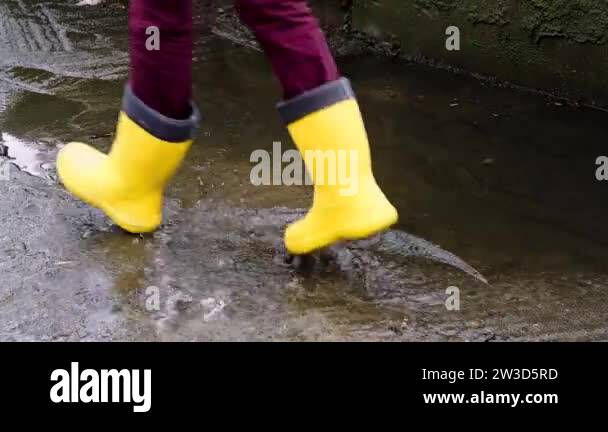Run through puddles in yellow rubber boots. Walk in rain and enjoy the ...