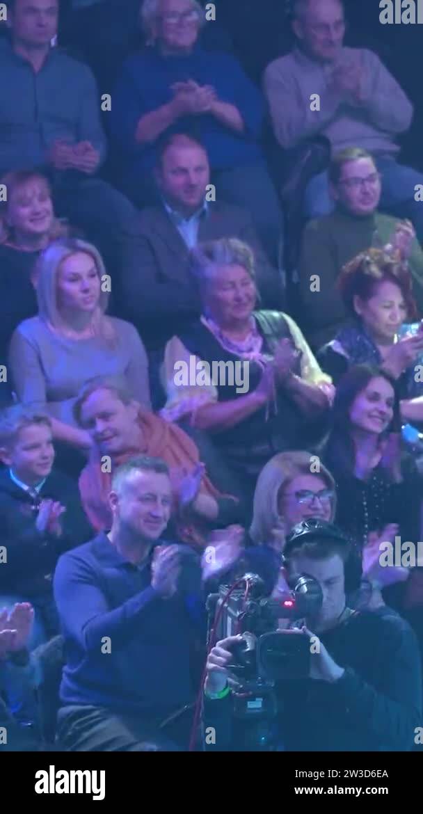 People viewers in a TV studio while recording a TV show. Vertical video ...