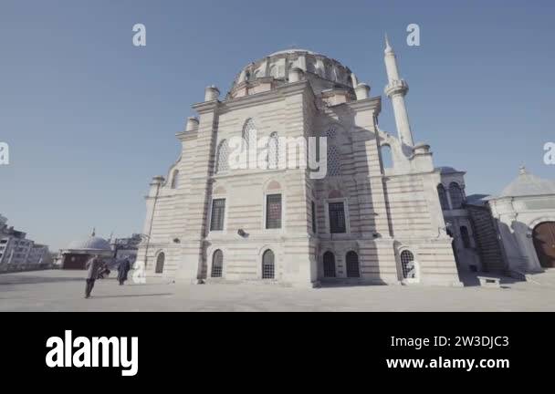 Bottom rear view of a giant muslim mosque on blue sky background ...