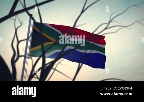 South Africa flag flying on a pole in sunlight. Backlit South African ...