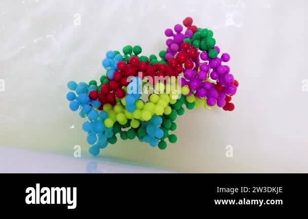 plastic model of a malicious virus molecule and a stream of clean water ...