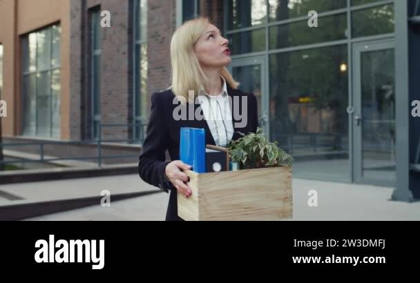 Angry woman in 30s muttering and scolding her employers while walking ...