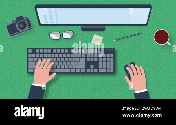 Workplace with a monitor, a hand above the keyboard, a computer mouse ...