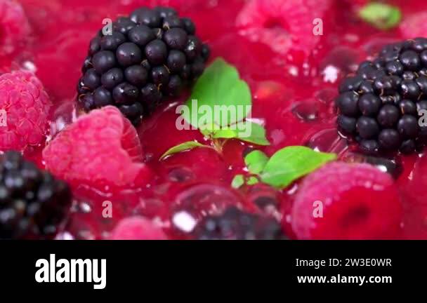 The berries are being preparing for dessert. The berries are cooking ...