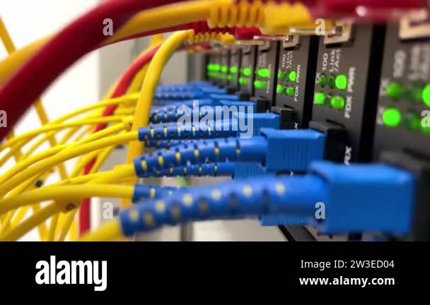 fiber optic converter, fiber optic and ethernet cable plugged into the ...