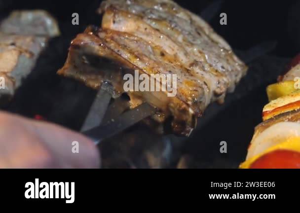 Someone's frying a kebab. The chef is preparing a meat kebab. Shish ...