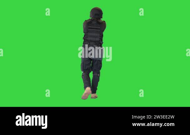 Armed Police Officer Aiming and shooting with a pistol while walking on ...