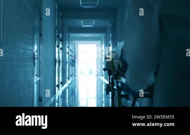 Rolling table with a patient is getting relocated by a paramedic Stock ...