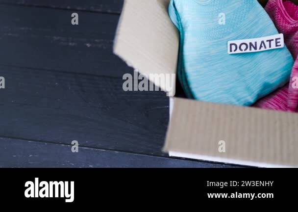 box with Donate label with second-hand items to be given away, charity ...