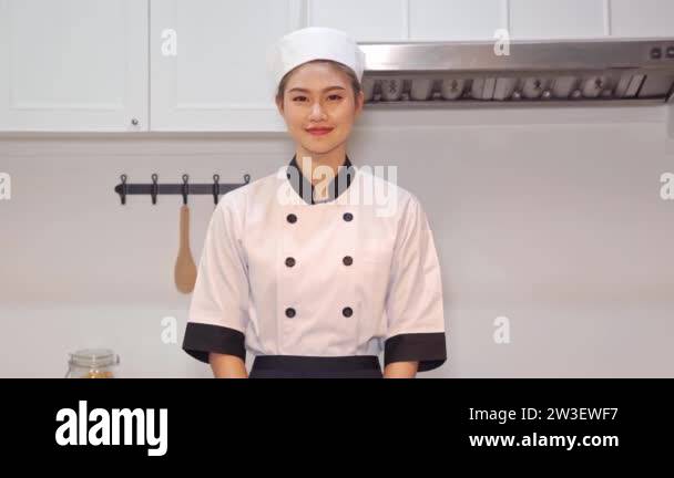 Beautiful Asian chef woman smile cross arm in kitchen,Happiness and ...
