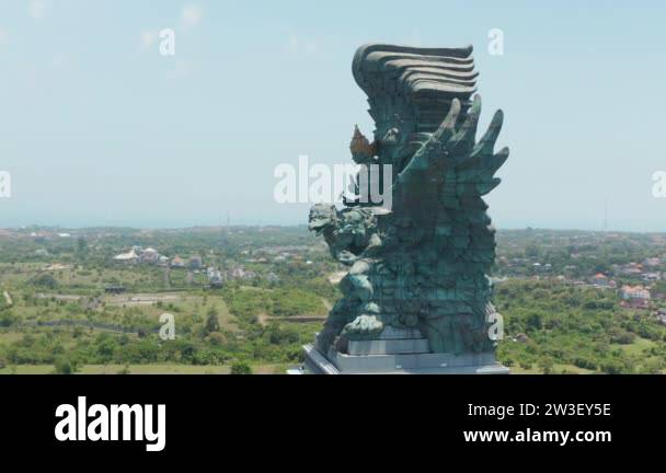 Aerial shot circling the Garuda Wisnu Kencana statue in Bali, Indonesia ...