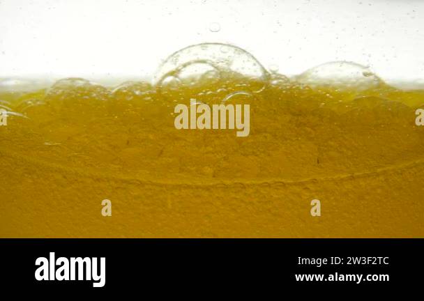 A close-up view of unrefined sunflower oil for nutrition, which from ...