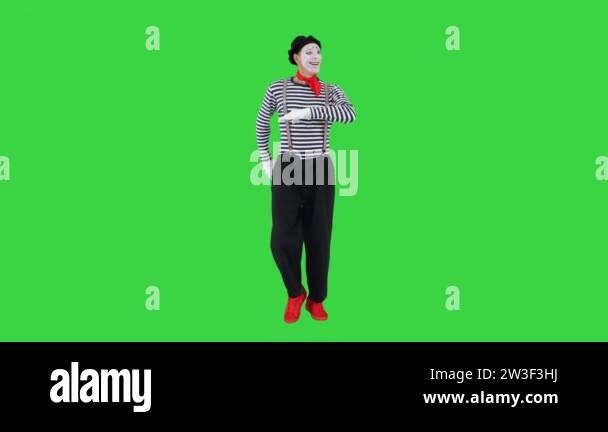 Mime artist smile and simulate walking on a Green Screen, Chroma Key ...