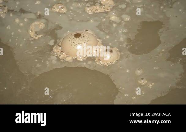 180 fps slow motion close up of bubbles on sulphur caldron in ...