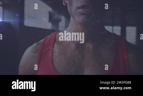 Animation of golden shapes floating over man flexing his muscles ...