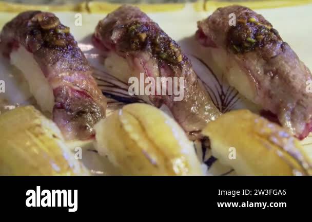 seared flounder, flatfish and wagyu beef aburi nigiri sushi Stock Video ...