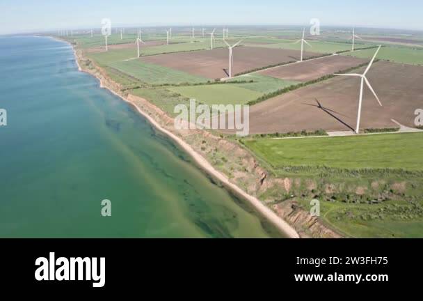 Wind Turbine Power Generators At Sea Coastline. Alternative Renewable ...