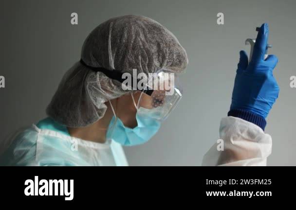 Microbiologist works in the laboratory with reagents and blood samples ...