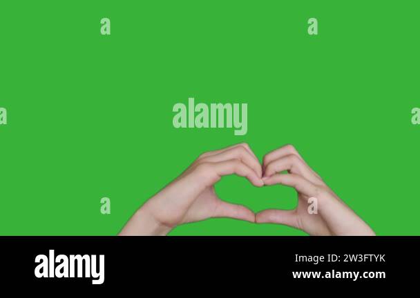 4K footage real time close-up hand of asian young girl making a heart ...