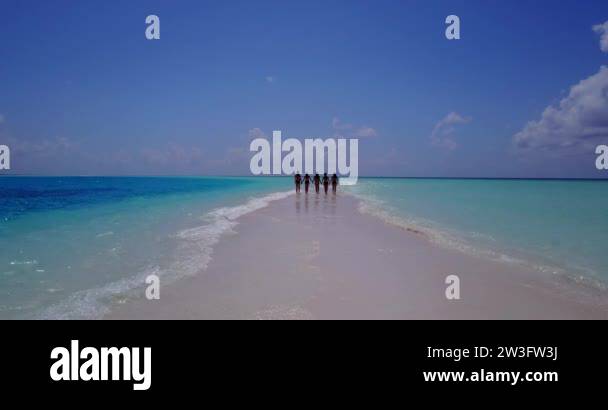 video the tan girls in bikini walking on sea scythe holding hands Stock ...