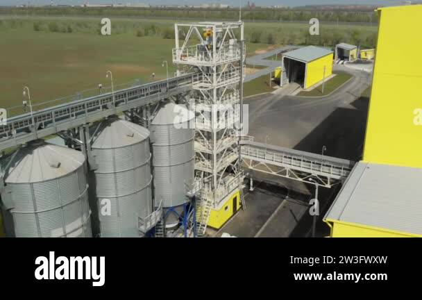 A large group of grain dryers complex for drying grain. A base of barns ...