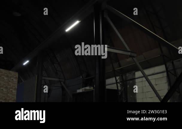 Led lights lamps on metal beams partitions turn off and turn on in dark ...