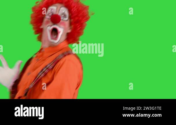 Funny clown running away from someone on a Green Screen, Chroma Key ...