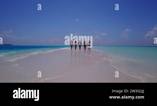 video the tan girls in bikini walking on sea scythe holding hands Stock ...