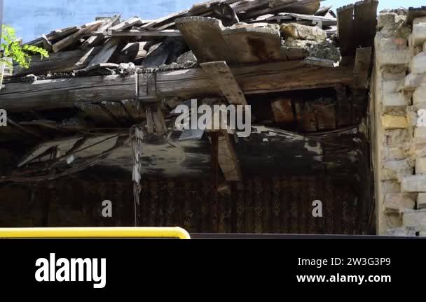 Remains of hurricane or earthquake disaster damage on ruined old house ...