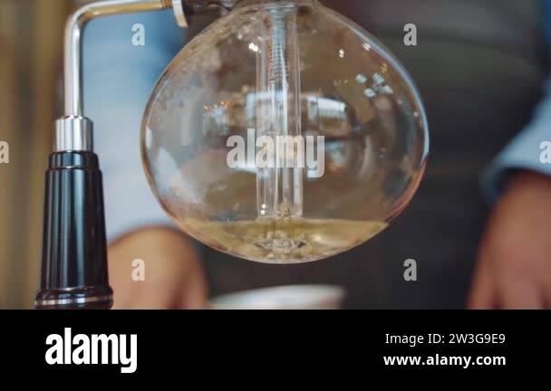 Coffee Syphon close up alternative method of making in coffee shop and ...