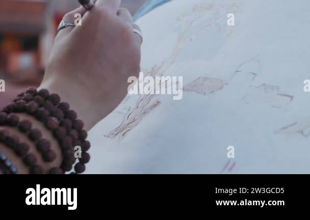 Macro side view of artists hand drawing picture with pencil slow motion ...