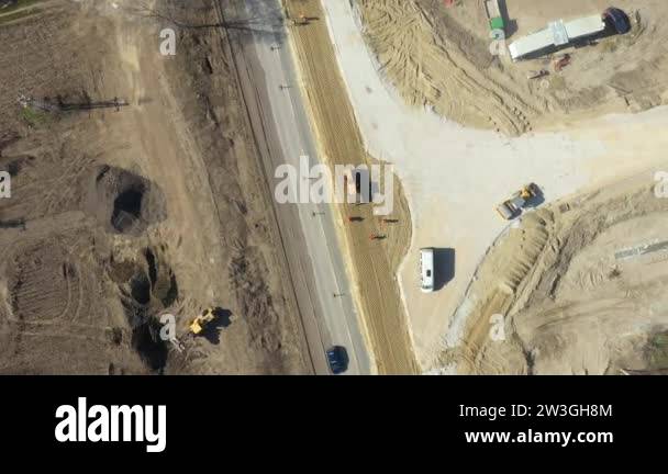 Dolly moving shot upward, above top view, overhead on huge road roller ...