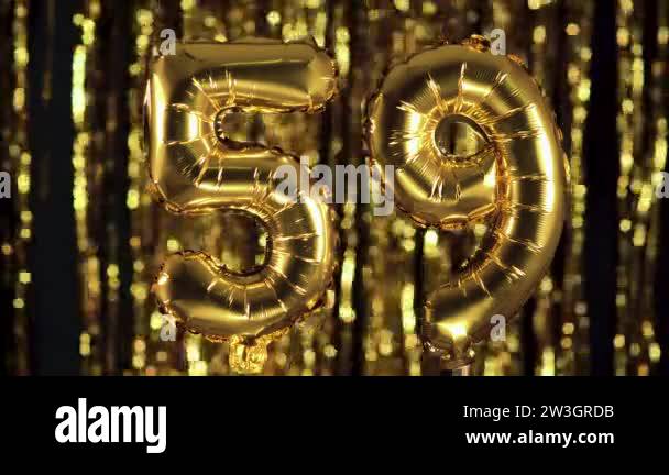 The golden number 59 fifty nine is made from an inflatable balloon on a ...