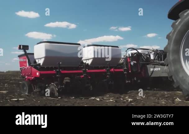 Tractor with special precision planters, seeder is working in the field ...